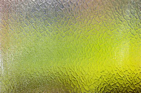 Abstract Colors Orange Yellow Green Through A Patterned Privacy Glass