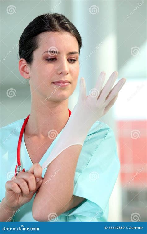 Nurse Putting On Gloves Royalty Free Stock Images Image 25342889
