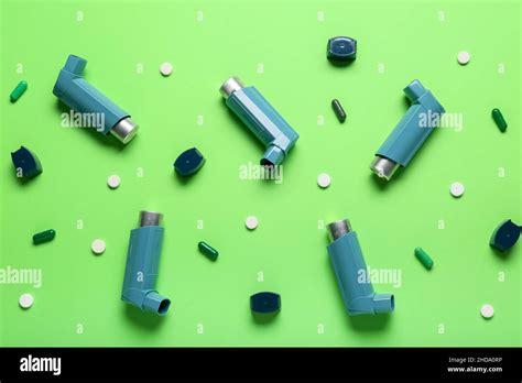 Composition With Asthma Inhalers And Pills On Green Background Stock