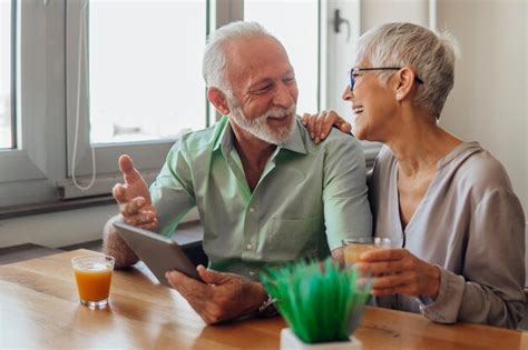 Premium Photo Freepik Older Couple Using Digital Tablet