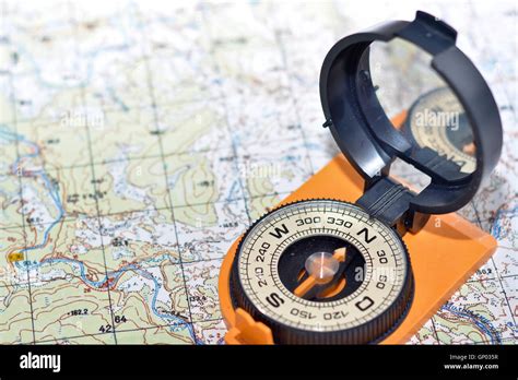 Compass And Map Friends Travelers Magnetic Compass On A Topographic