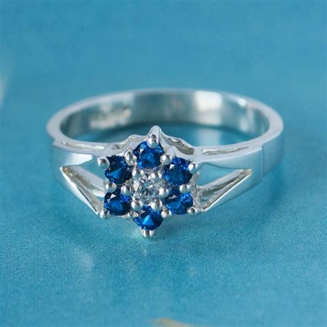 Sterling Silver Flower Cluster Ring With Blue Sapphire And White Cubic