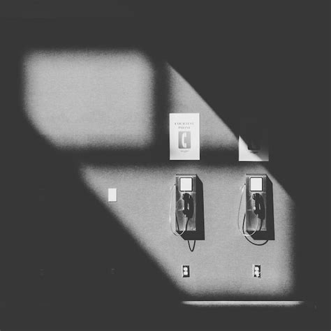 Premium Photo Landline Telephones Mounted On Wall