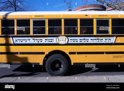 A School Bus With A Hebrew Language Logo For The Nitra Hasidic Jewish