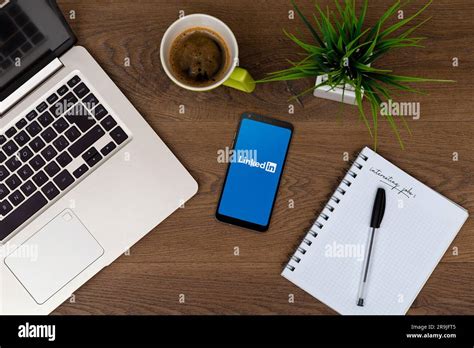Linkedin App On Phone Screen Workspace Top View Table Desk With