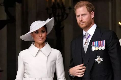 Prince Harry Looks Miserable As Meghan Smiles In First Public Outing