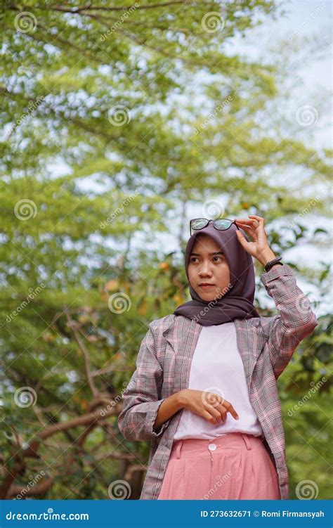 Portrait Of A Muslim Woman Holding Glasses On Her Head Stock Image