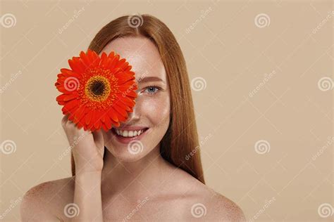 Redhead Girl With Naked Shoulders Holds Gerbera Stock Image Image Of
