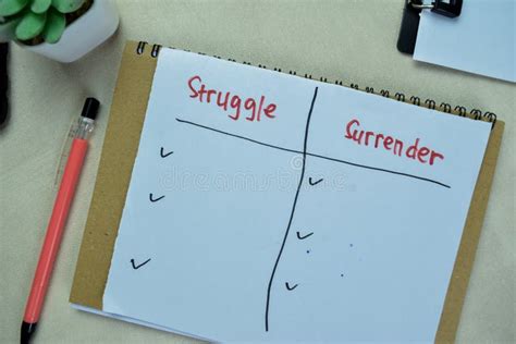 Concept Of Struggle And Surrender Write On Paperwork Isolated On Wooden Table Stock Image