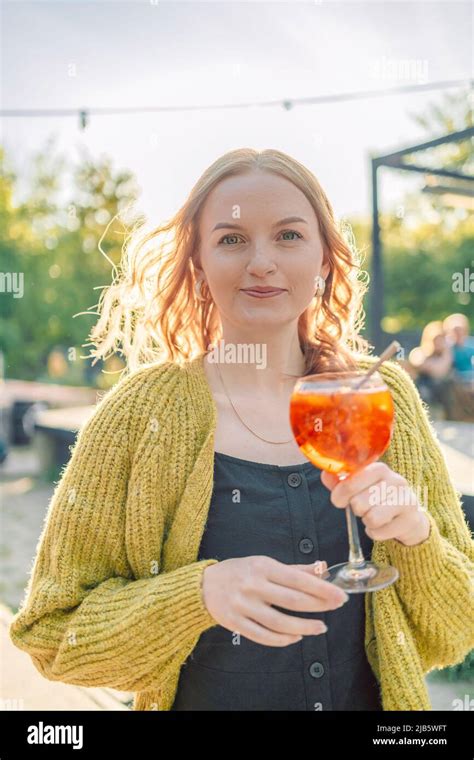 Beautiful European 30s Girl Having Fun In Cafe And Drinking Fruit