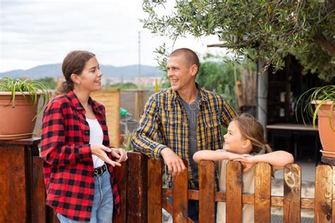 Man Woman And Girl Talking Near Fence Stock Image Image Of Rural