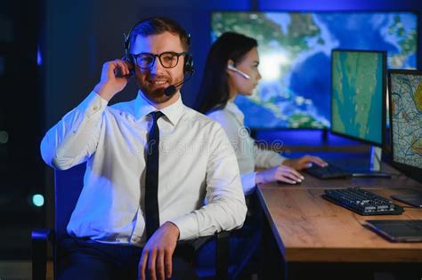 Photo Of A Successful Dispatcher Working On A Computer In The Office