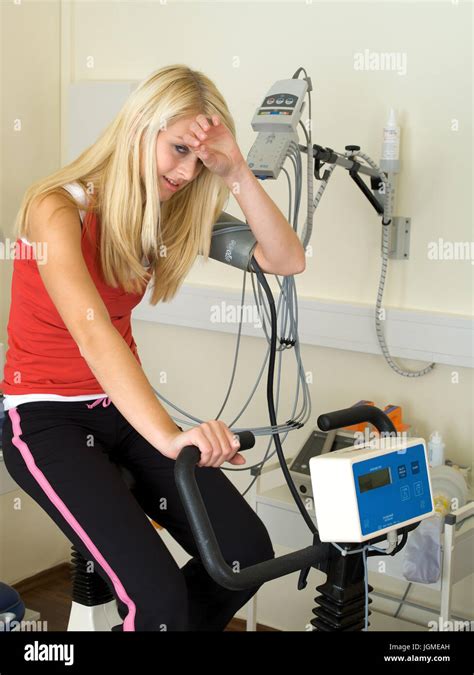 Young Woman Carries Out An Ergometer Test In The Medical Practise