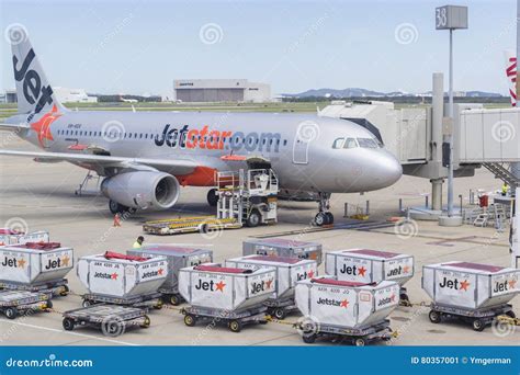 Baggage Trucks And Jetstar Aircraft At Brisbane Airport Editorial Photo Image Of Airways