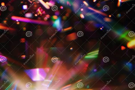 Festive Colorful Light Rays And Particles Bokeh On Dark Background
