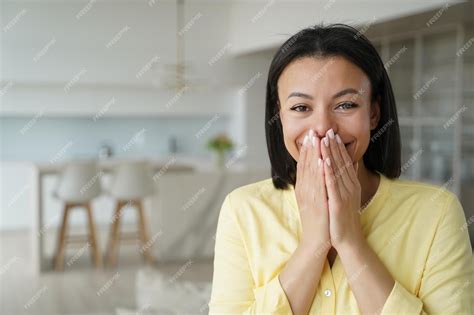 Premium Photo Laughing Female Covers Mouth With Hands Giggling At