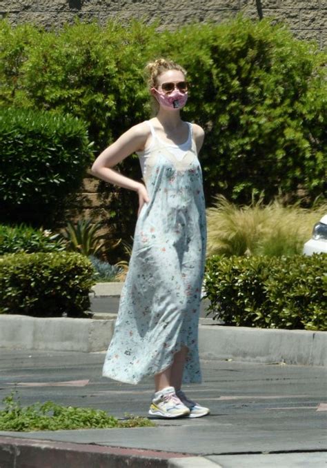 Elle Fanning In A Long Sleeveless Floral Print Dressout La Celebmafia