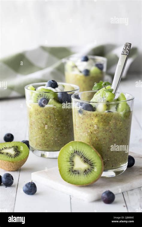 Kiwi Pudding Parfaits Topped With Vanilla Yogurt Blueberries And Kiwi