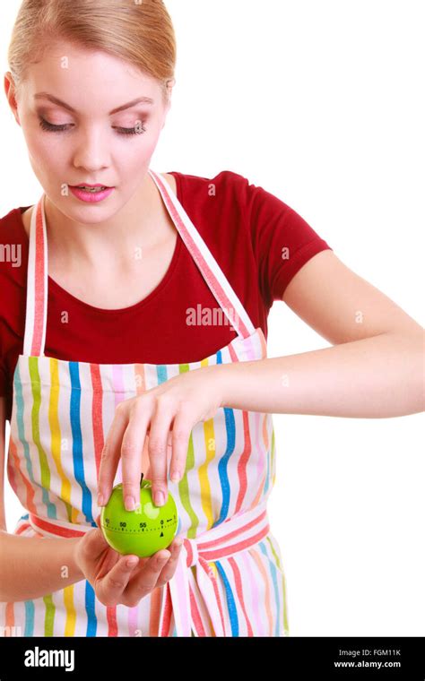 Housewife Or Chef In Colorful Kitchen Using Apple Timer Eggtimer Isolated Studio Shot Stock