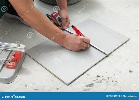 Worker Measuring And Marking Ceramic Tile On Floor Closeup Stock Image