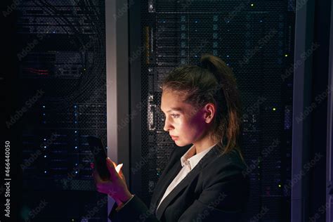 Woman Engineer Working In Data Center By Server Storage Racks Stock Photo Adobe Stock