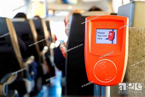 Orange Ticket Validation Machine On A Modern Public Transport Bus Stock Photo Picture And Low