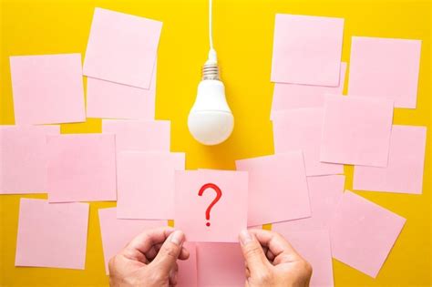 Premium Photo Question Mark And Light Bulb On Yellow Background The Process Of Problem Solving