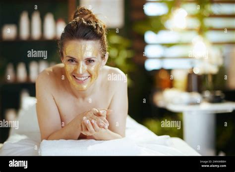Healthcare Time Smiling Modern Woman In Massage Cabinet With Golden