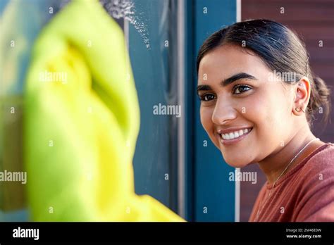 Woman Cleaning And Window Washing With A Smile To Clean Windows Dirt