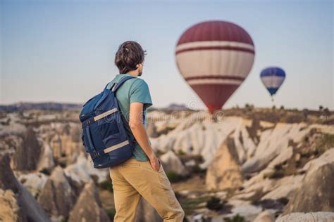 Tourist Man Looking At Hot Air Balloons In Cappadocia Turkey Happy