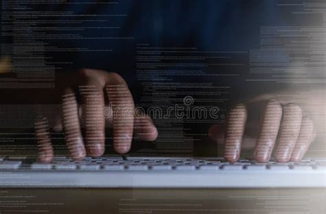 Tapping In To Another Network Shot Of An Unrecognisable Hacker Using A