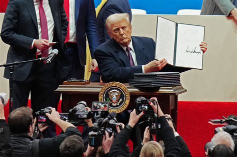President Trump Signs Executive Orders Before Inaugural Crowd At