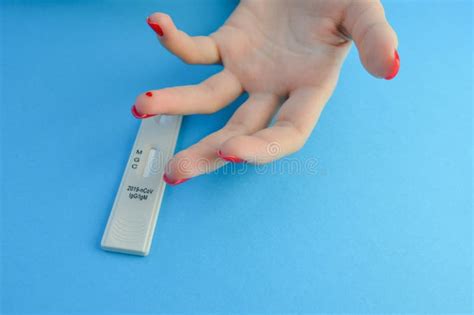 Female Lab Worker Holds Test Tube Of Blood Labeled Coronavirus COVID Disease Stock Image