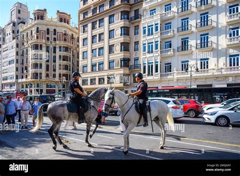Police Officers In Horses Or Mounted Police In The Exterior Of The