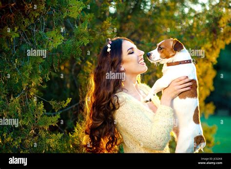 Happy Young Woman Hugging And Having Fun With Her Jack Russell Terrier