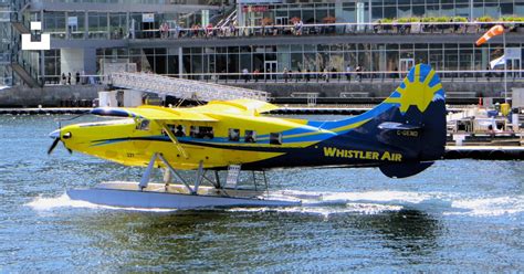 A Seaplane Floats On The Water Near A Building Photo Free Human Image On Unsplash