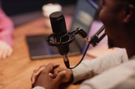 Premium Photo Man Speaking Into Microphone During Podcast