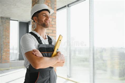 Profession Construction And Building Male Worker Or Builder In