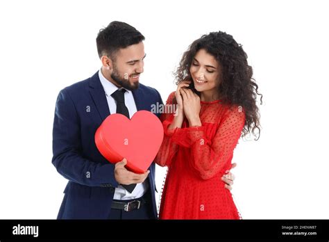 Young Man Greeting His Girlfriend On White Background Valentines Day
