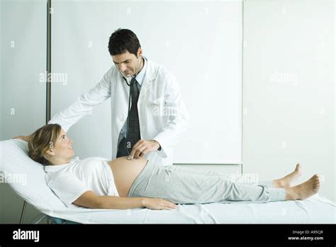 Pregnant Woman Being Examined By Doctor Stock Photo Alamy