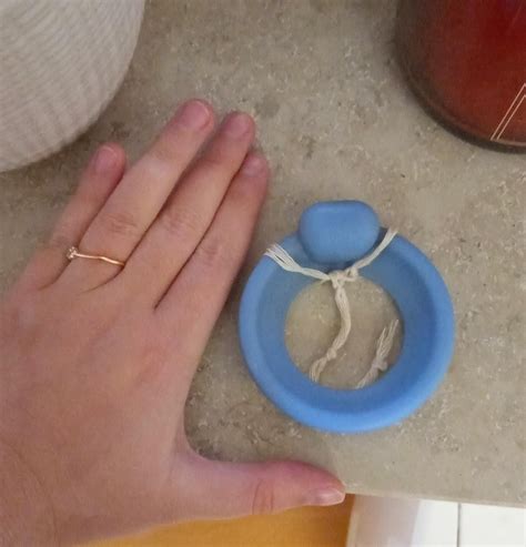 Blue Siliconrubber Ring With Around 8cm Diameter And Attached Strings