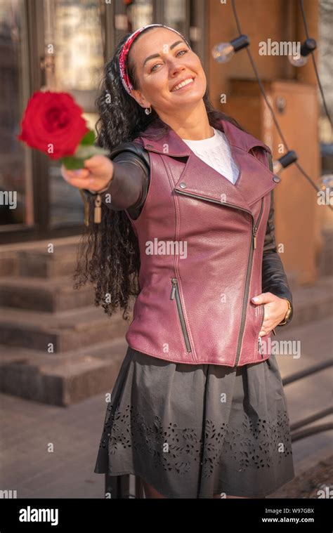 Love And Flirt Concept Happy Smiling Woman Gives A Red Rose Stock
