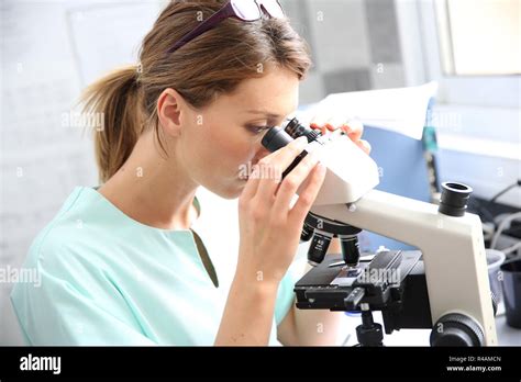 Doctor In Laboratory Looking Through Microscope Stock Photo Alamy