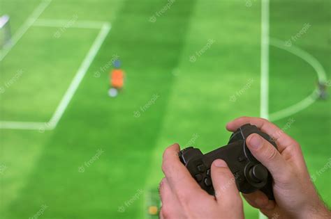Premium Photo Man Holding Game Controller Joystick While Playing Console Game