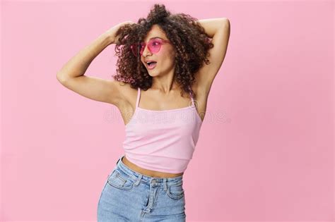Happy Woman Afro Curls Hair Dancing On A Pink Background In Summer Pink