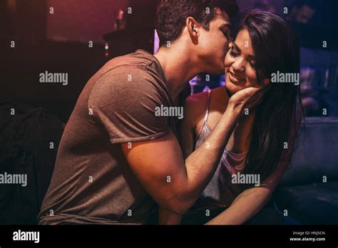 Young Couple In Love At The Night Club Man Kissing His Girlfriend