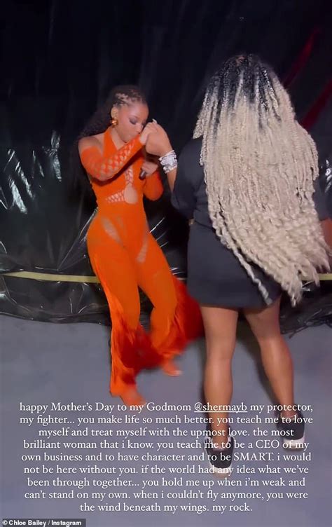 Chloe Bailey Shows Off Her Incredible Curves In Striking Neon Orange Cut Out Jumpsuit As She