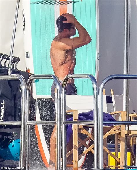 Zac Efron Shows Off His Chiseled Abs As He Goes Shirtless On A