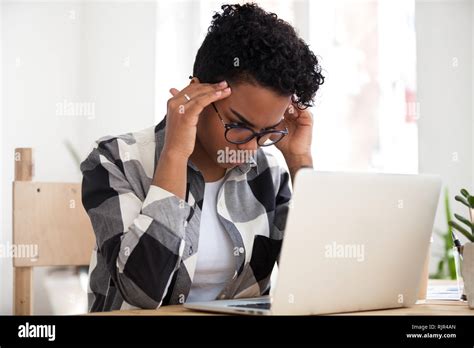 Stressed African Woman Concentrating Doing Difficult Online Computer
