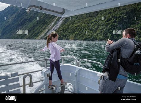 A Girl Doing A Titanic Pose For A Photograph During A Boat Trip On